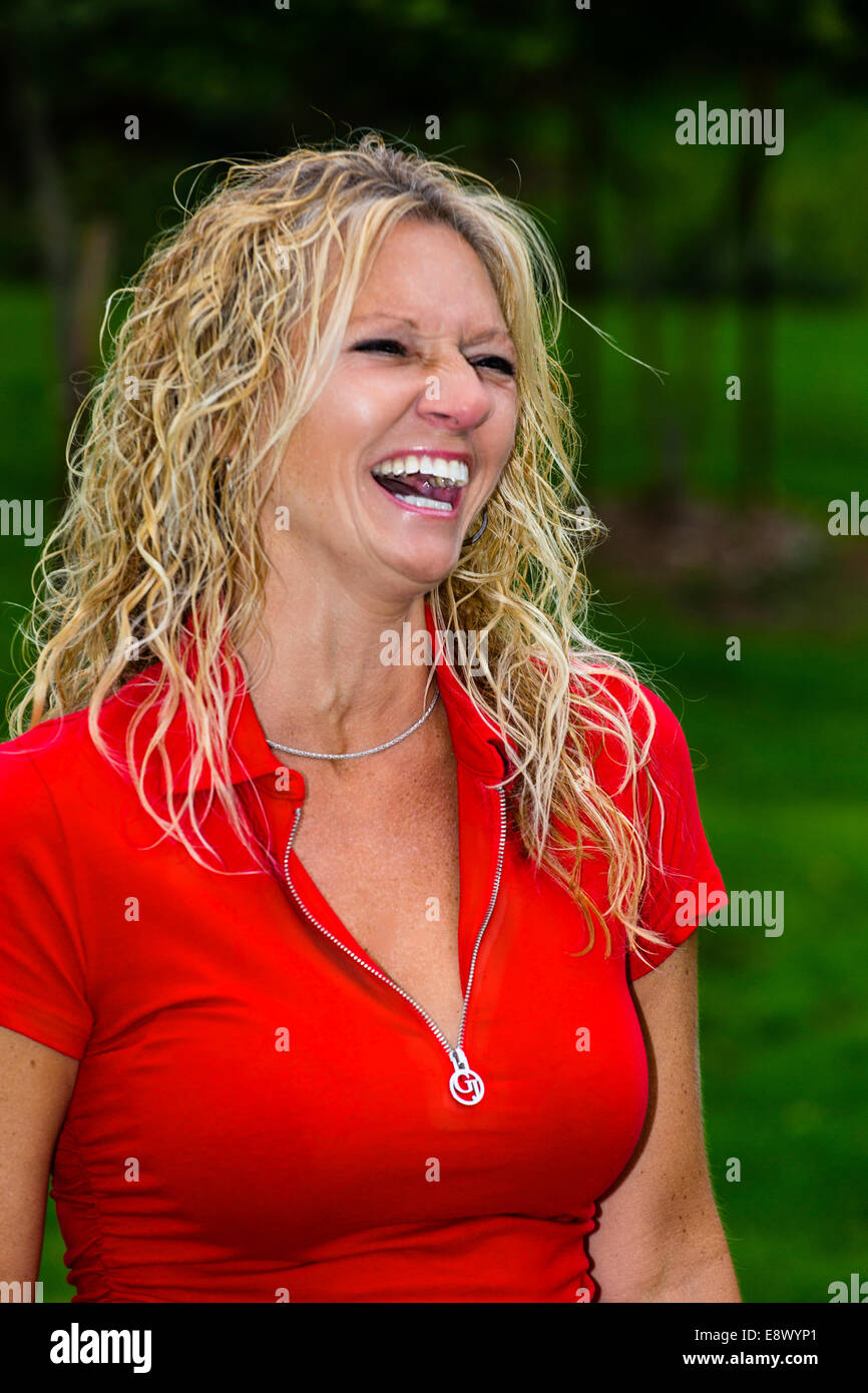 Female model in casual clothing laughing Stock Photo - Alamy