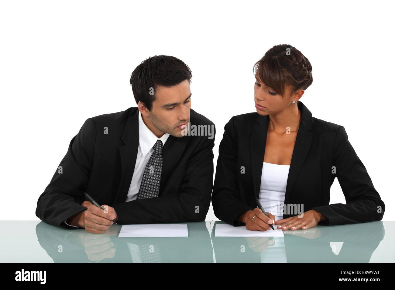 Two business people comparing notes hi-res stock photography and images ...