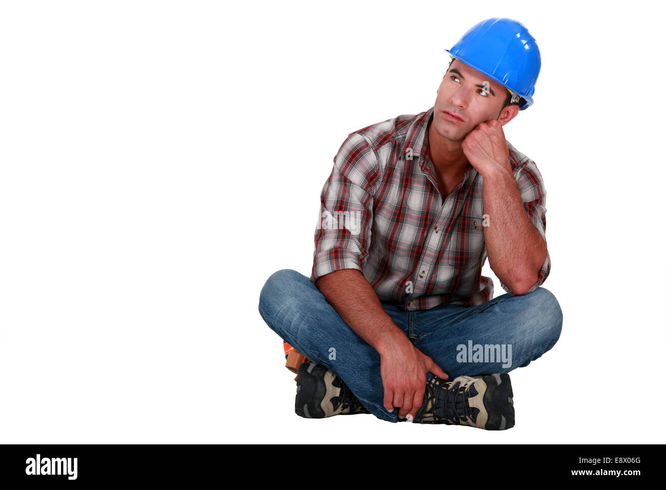 A pensive construction worker Stock Photo - Alamy