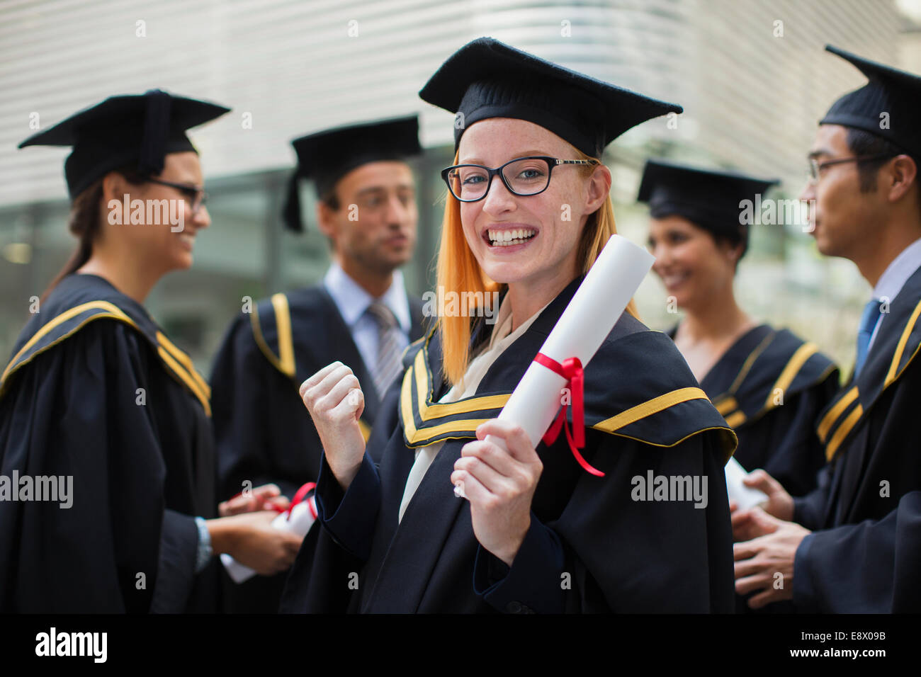 Student in cap and gown celebrating Stock Photo - Alamy