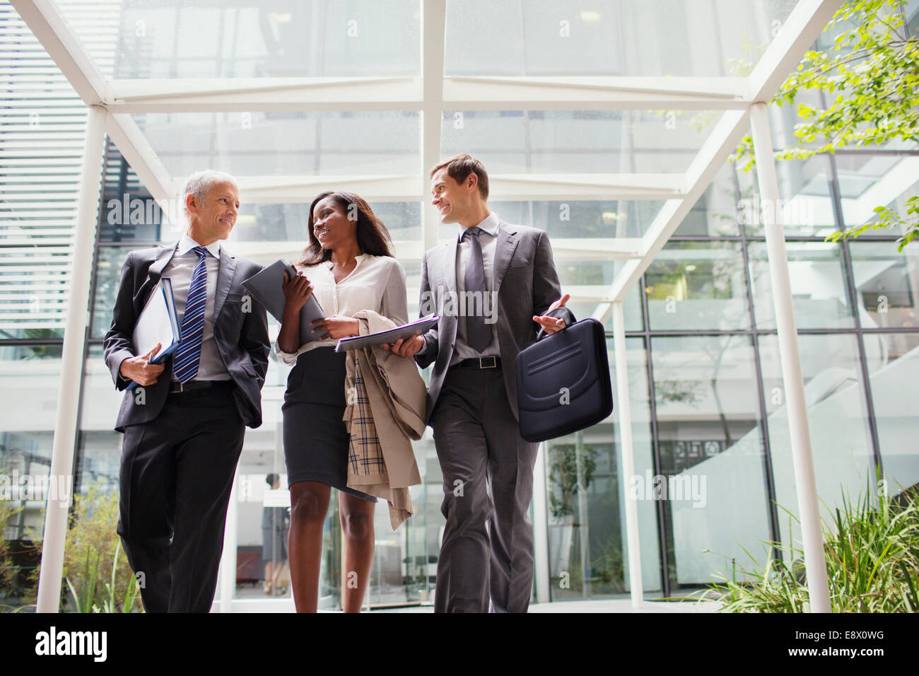 3 business people walking hi-res stock photography and images - Alamy