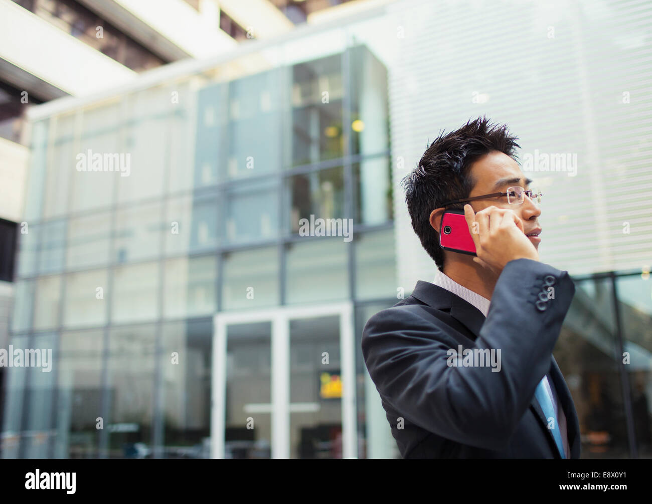 Eyeglasses man talking cellphone office hi-res stock photography and ...