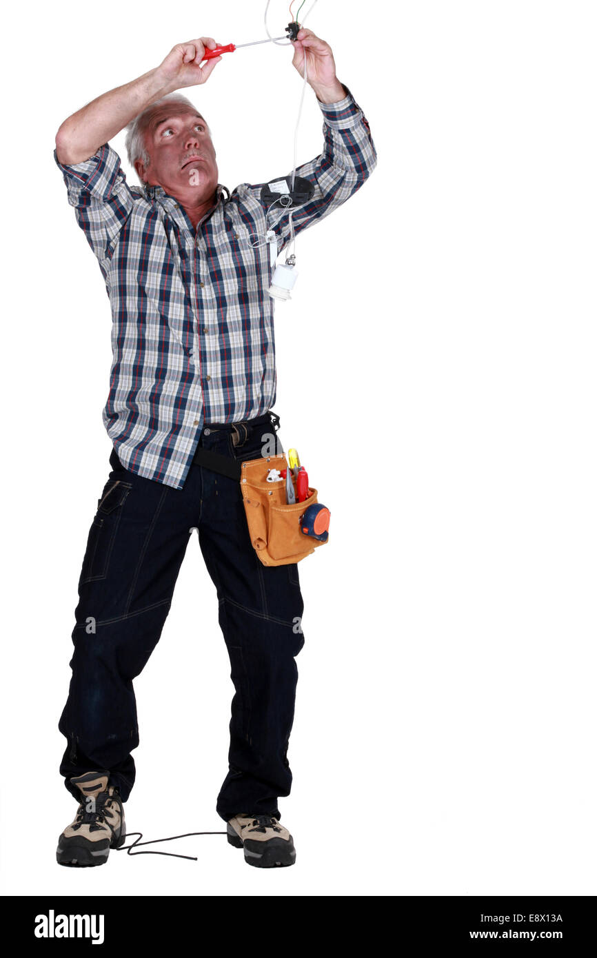 Electrician fixing the installation Stock Photo - Alamy