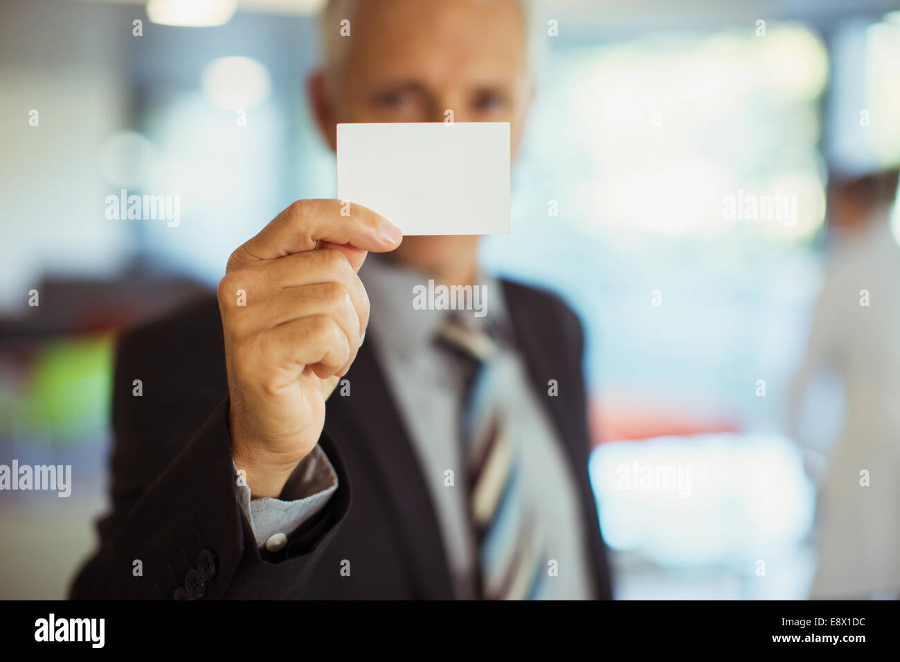 Businessman holding business card hi-res stock photography and images ...