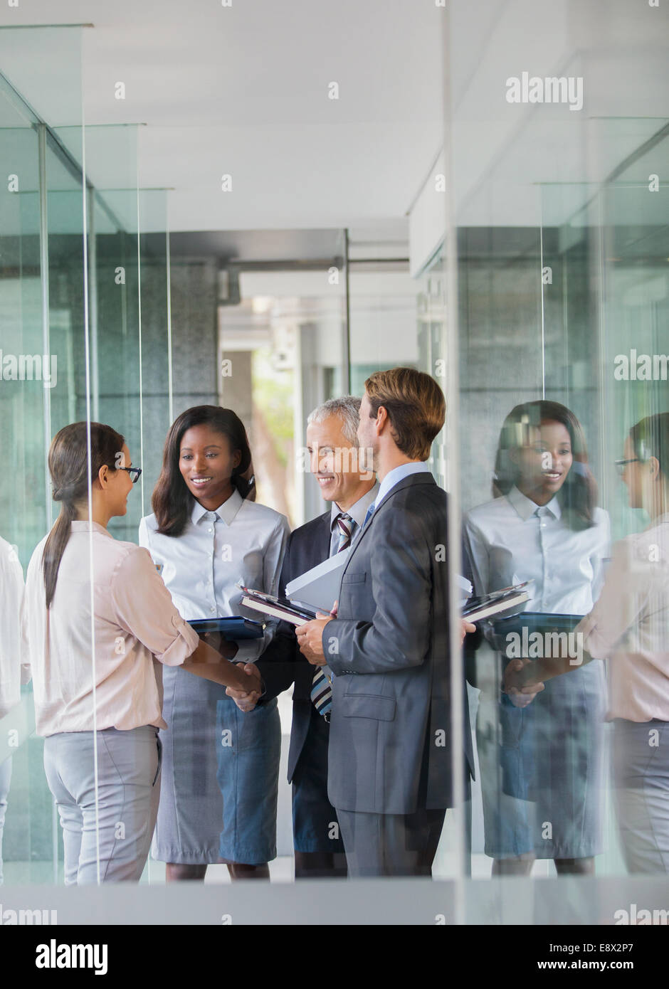 Business people talking in hallway hi-res stock photography and images ...