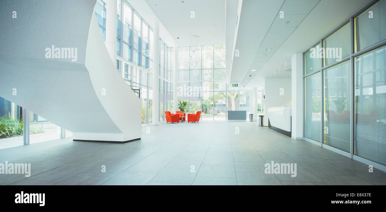Light shining through windows in office building Stock Photo - Alamy