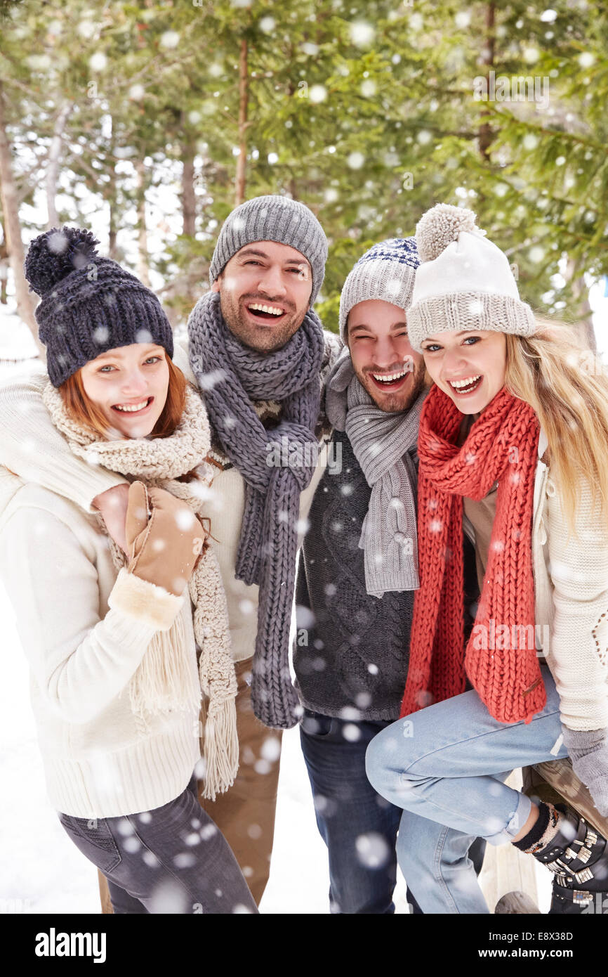 Friends hugging in the snow Stock Photo - Alamy