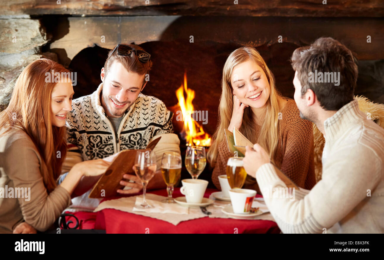 Friends ordering food at restaurant Stock Photo - Alamy