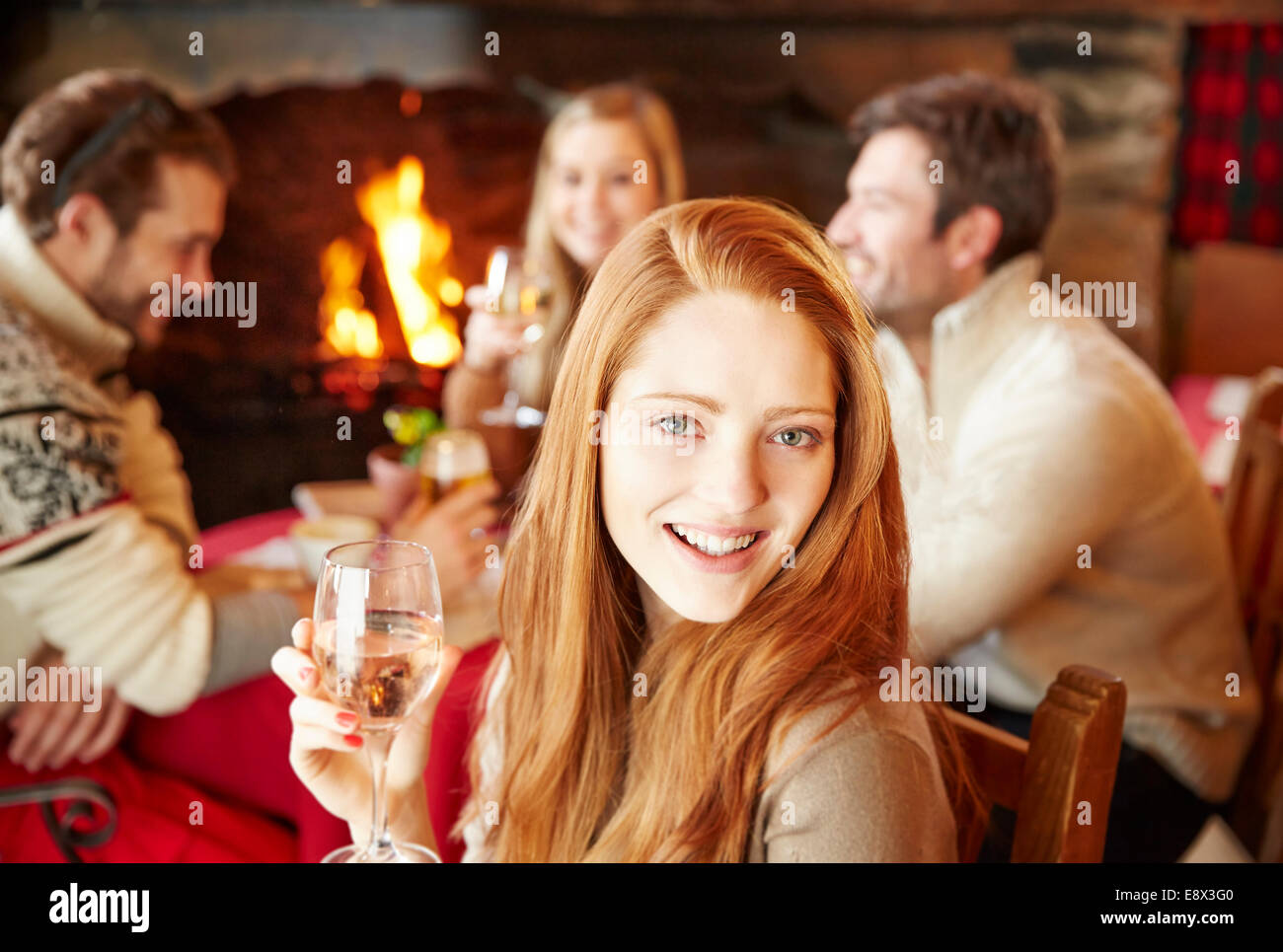 Woman enjoying drinks with friends Stock Photo - Alamy