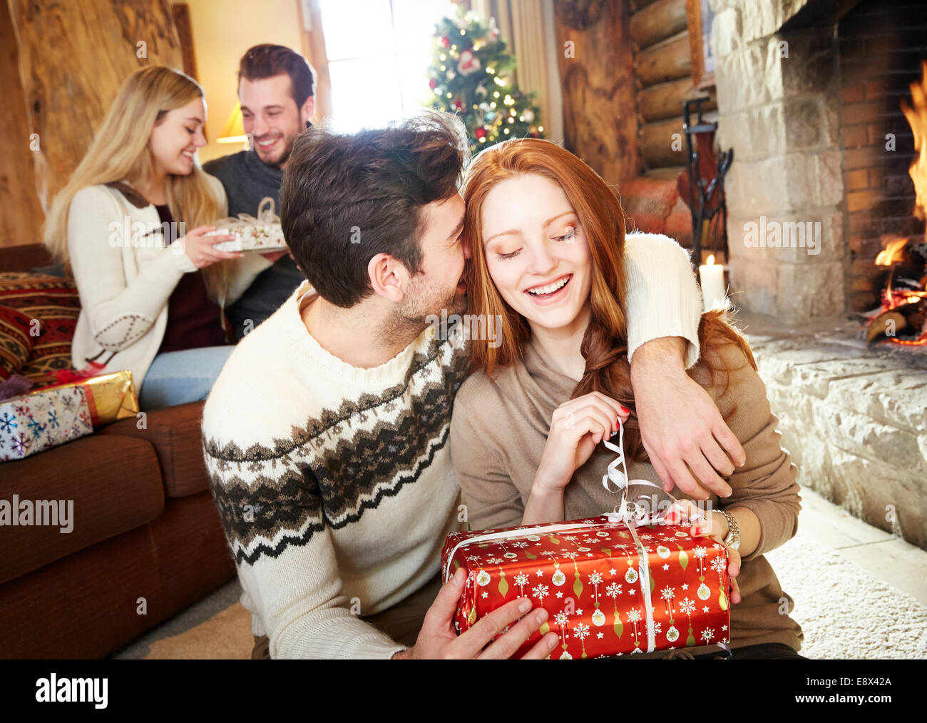Couple exchanging gifts on Christmas Stock Photo - Alamy