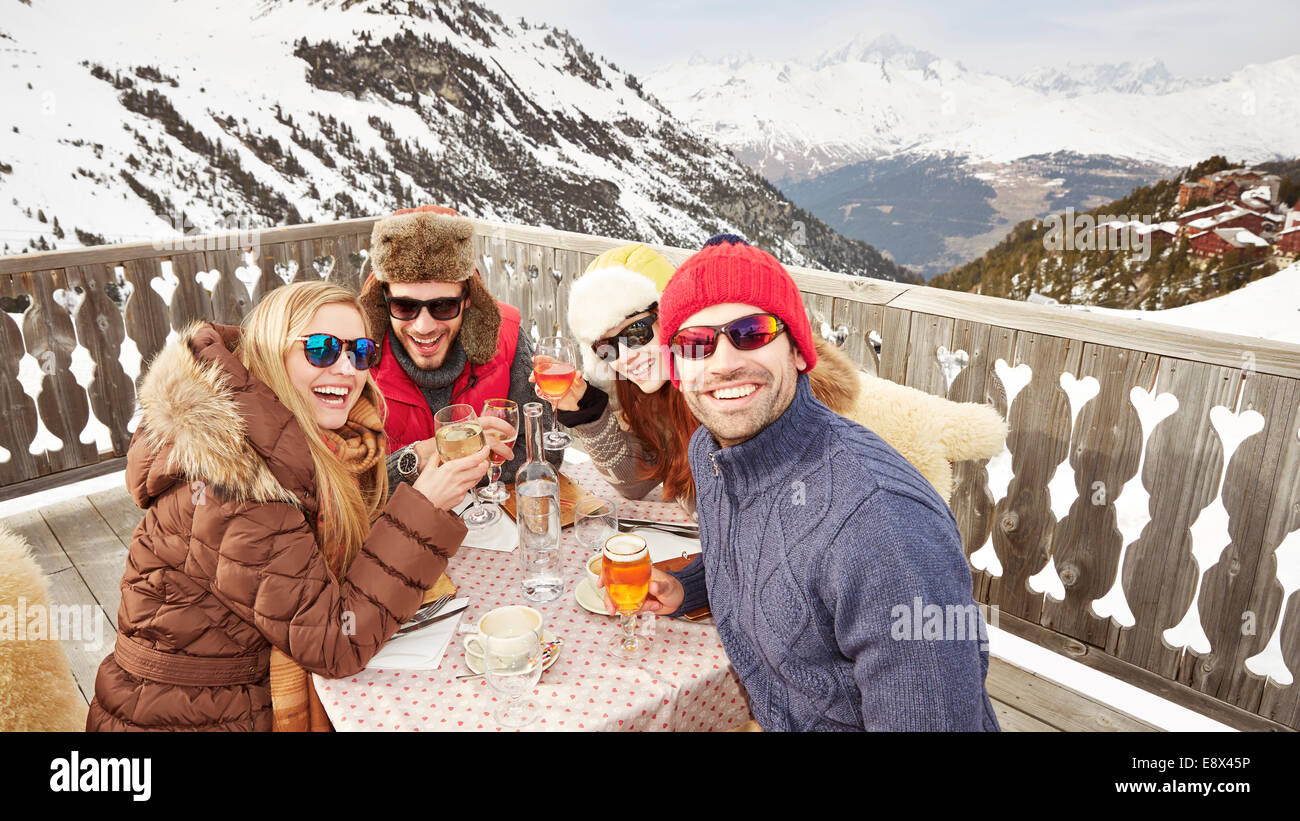 Friends enjoying drinks together Stock Photo - Alamy