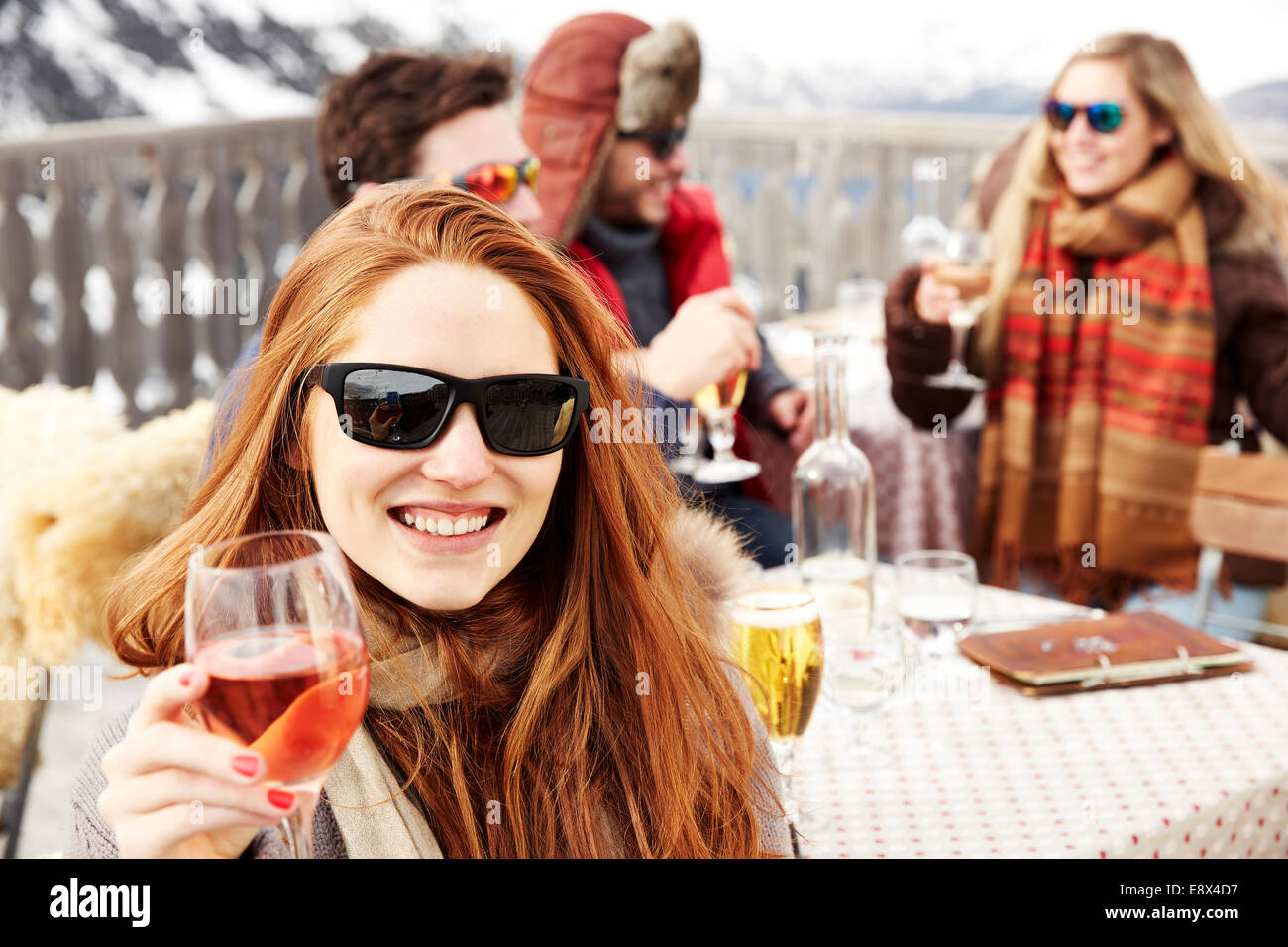 Woman enjoying drinks with friends Stock Photo - Alamy