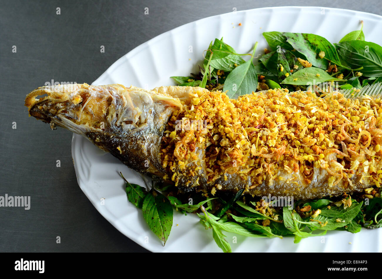 fried fish Sheatfish (Micronema apogon) on table at Thai native market ...