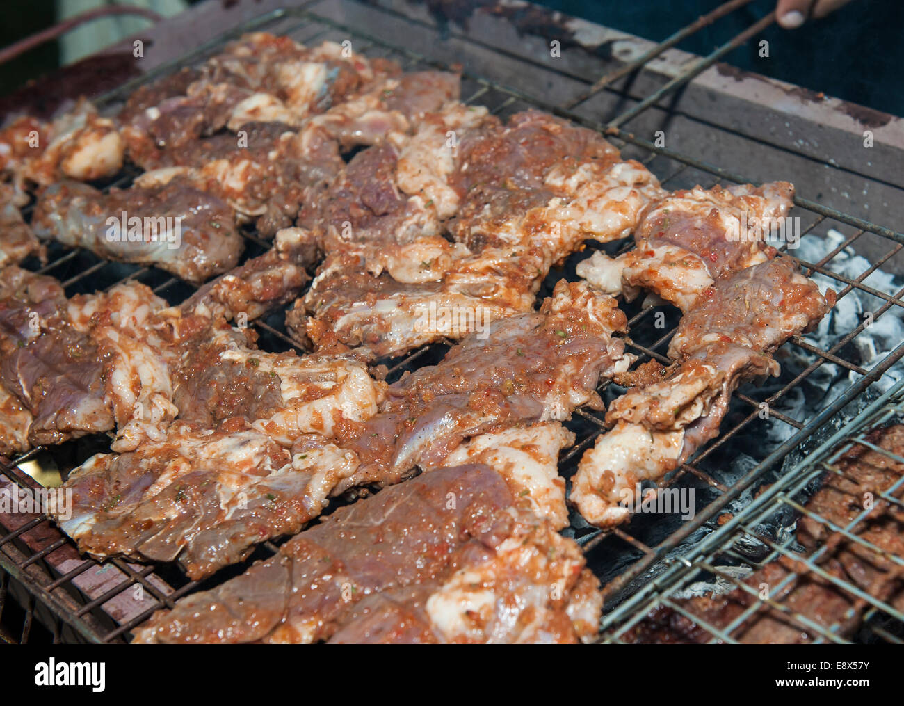 Cooking the meat on the barbecue hi-res stock photography and images ...