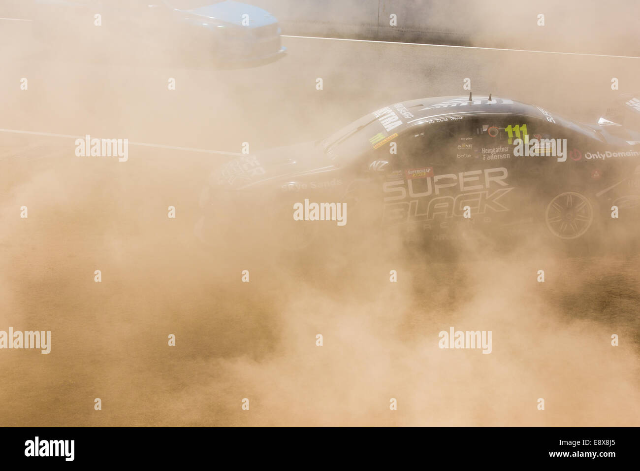 A race car runs wide off the race track and into the dirt Stock Photo ...