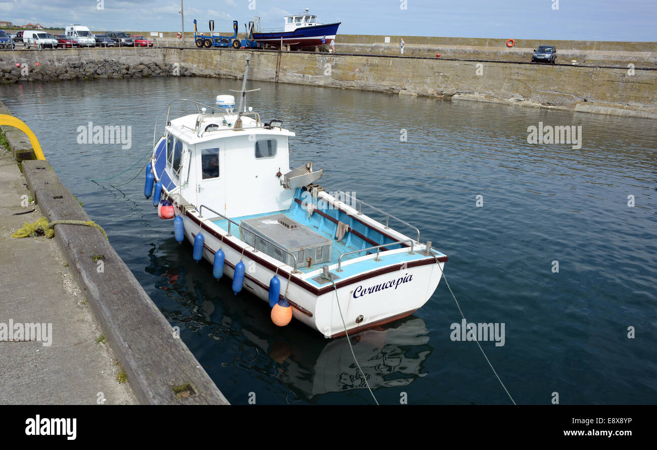 Boat fishing harbour seahouses hi-res stock photography and images - Alamy