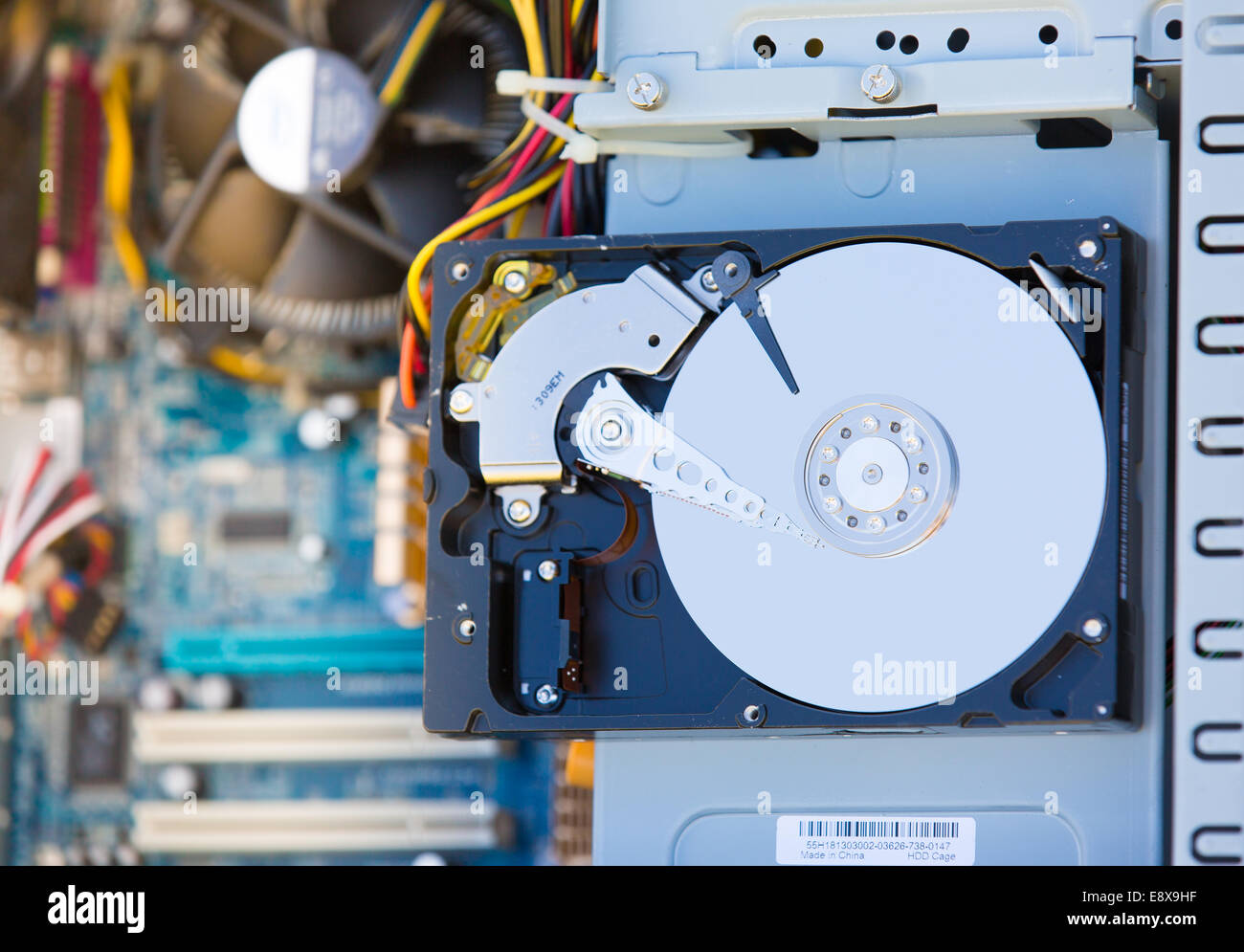 A close-up of hard disk data storage drive in a PC home computer from ...