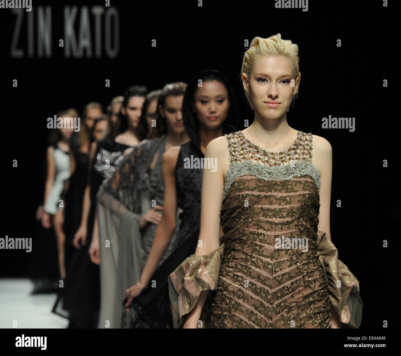 Tokyo, Japan. 16th Oct, 2014. Models display creations designed by Toru ...