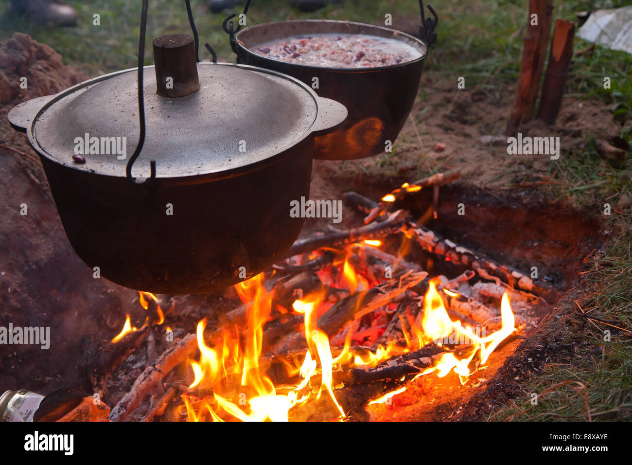 Cooking the meal in a kettle on the camp fire:River rafting expedition ...
