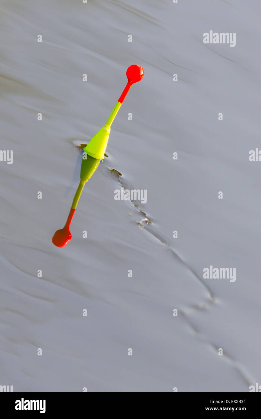 Old fishing float floating in the water Stock Photo - Alamy