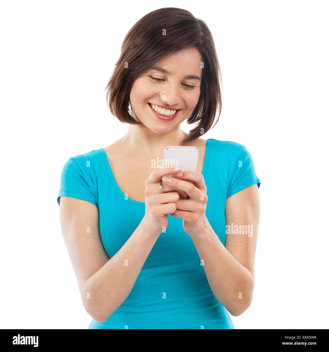 Beautiful girl writing a message on her phone, isolated on white Stock ...