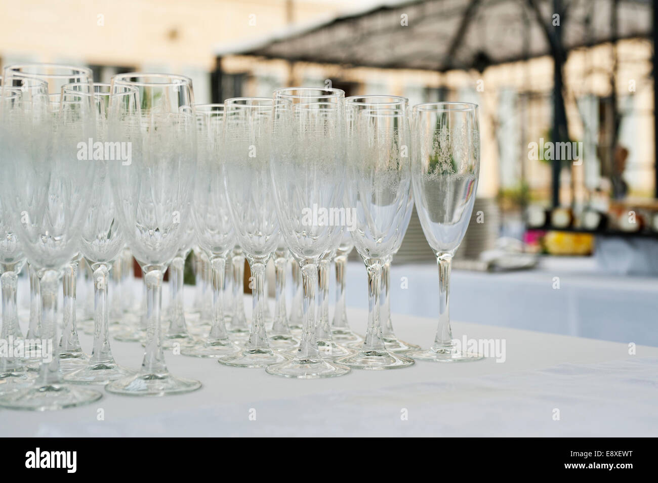 buffet table with rows of empty glasses Stock Photo - Alamy