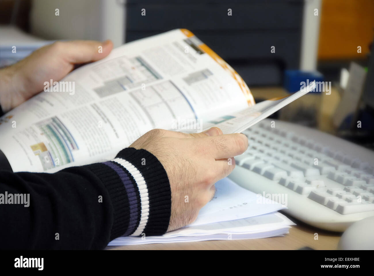 Reading a magazine Stock Photo - Alamy