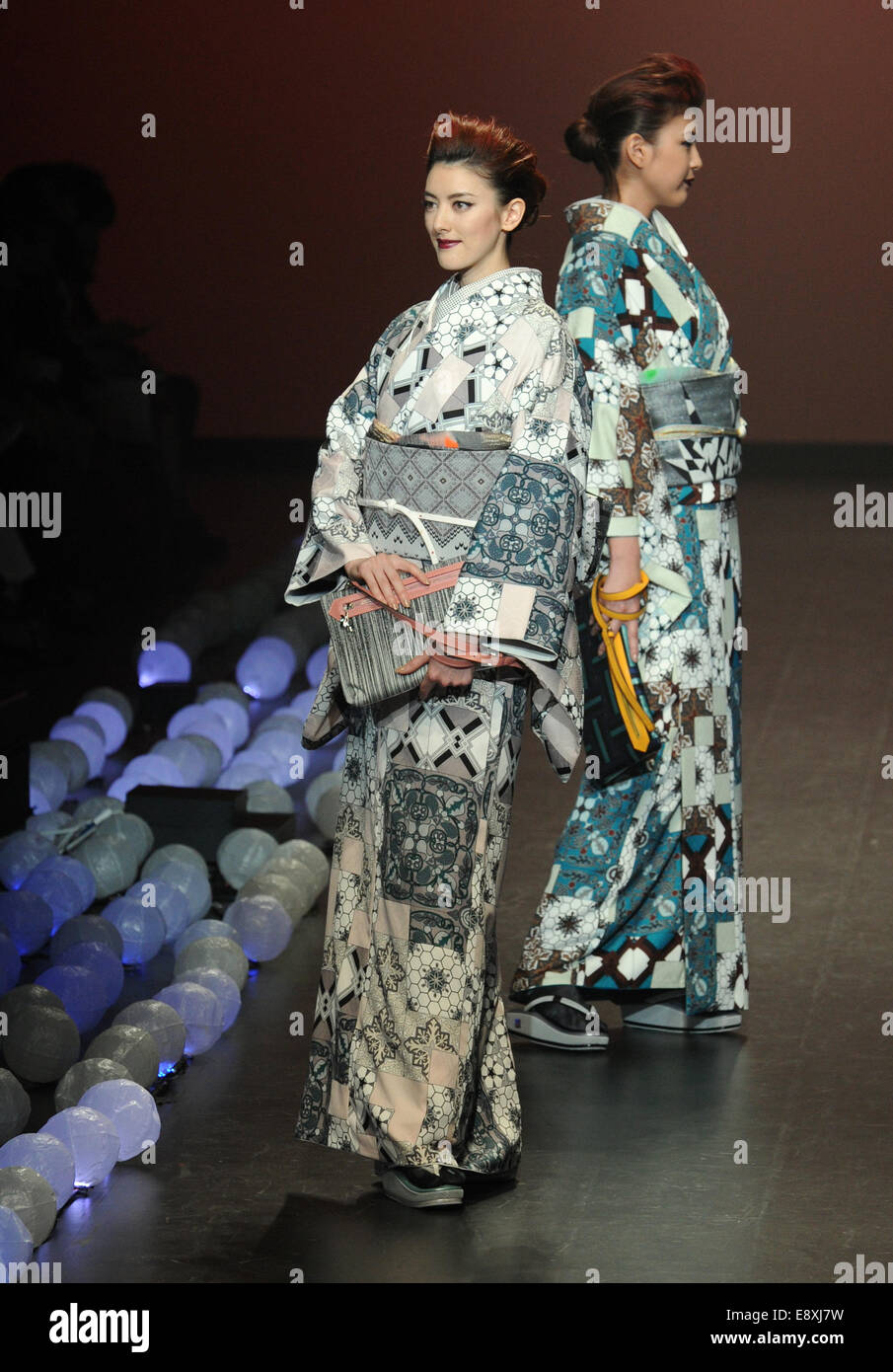 Tokyo, Japan. 16th Oct, 2014. Models display creations designed by ...