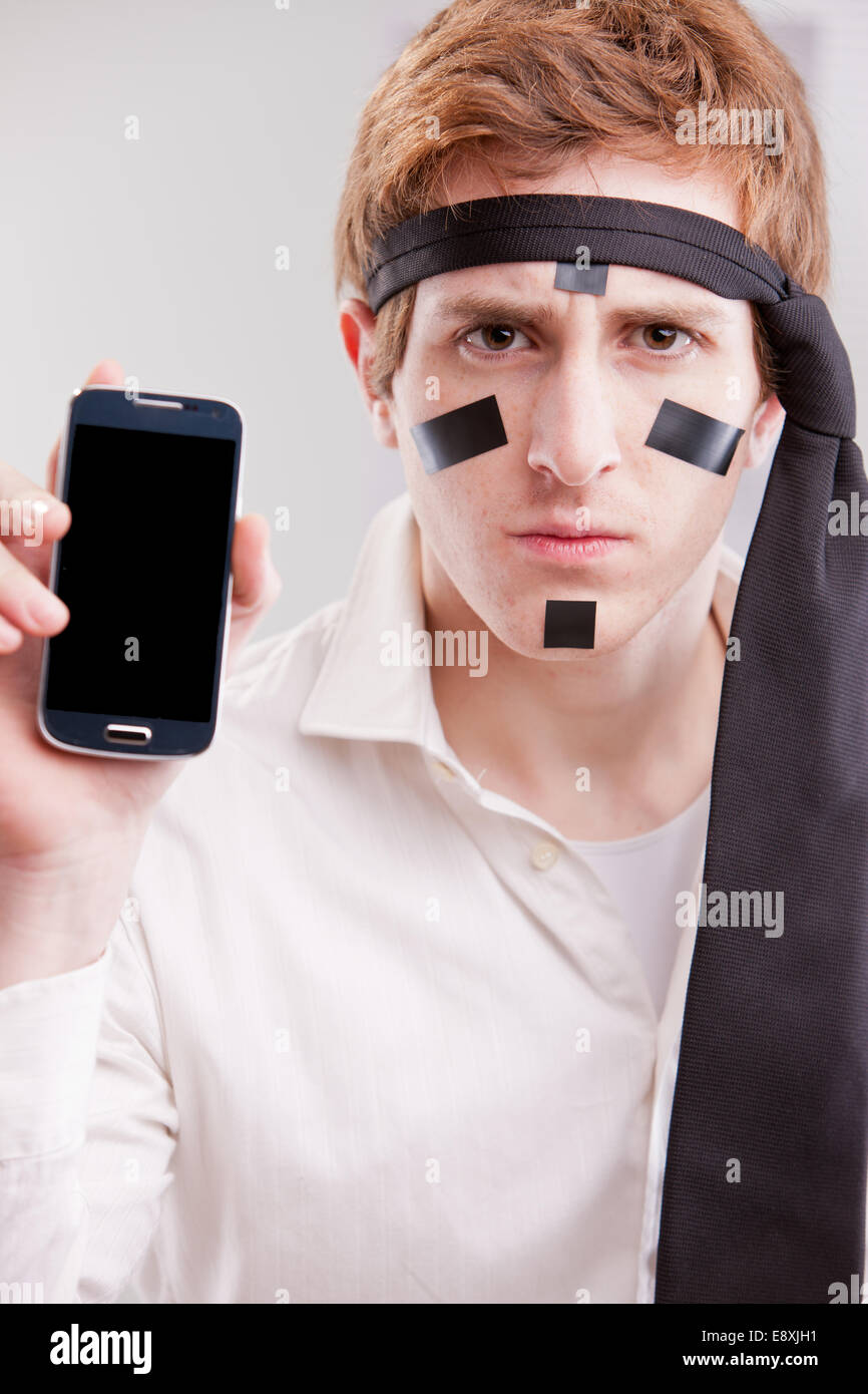 a young male warrior of the office wielding a mobile phone Stock Photo ...