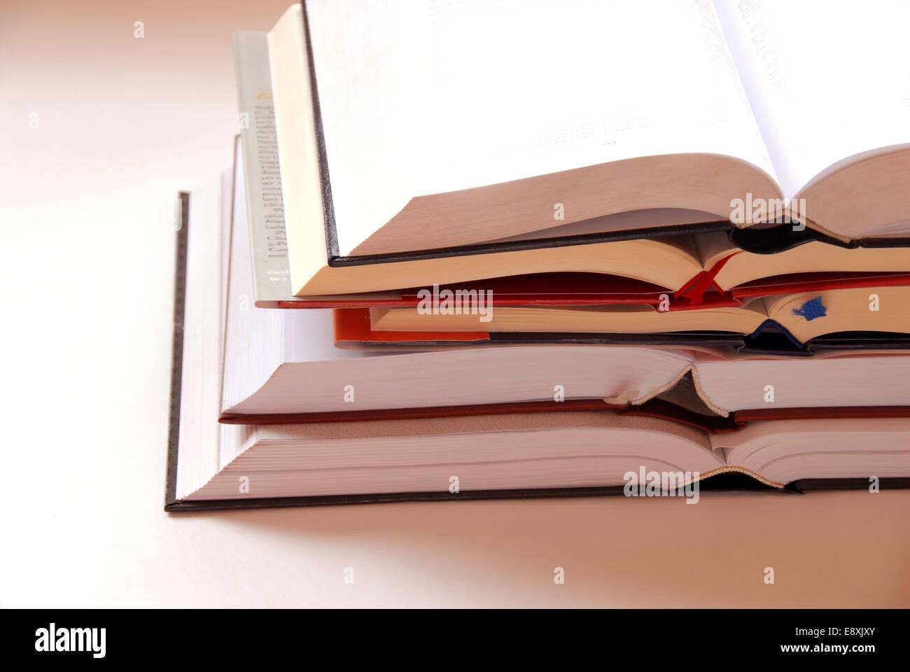 Opened books stack Stock Photo - Alamy