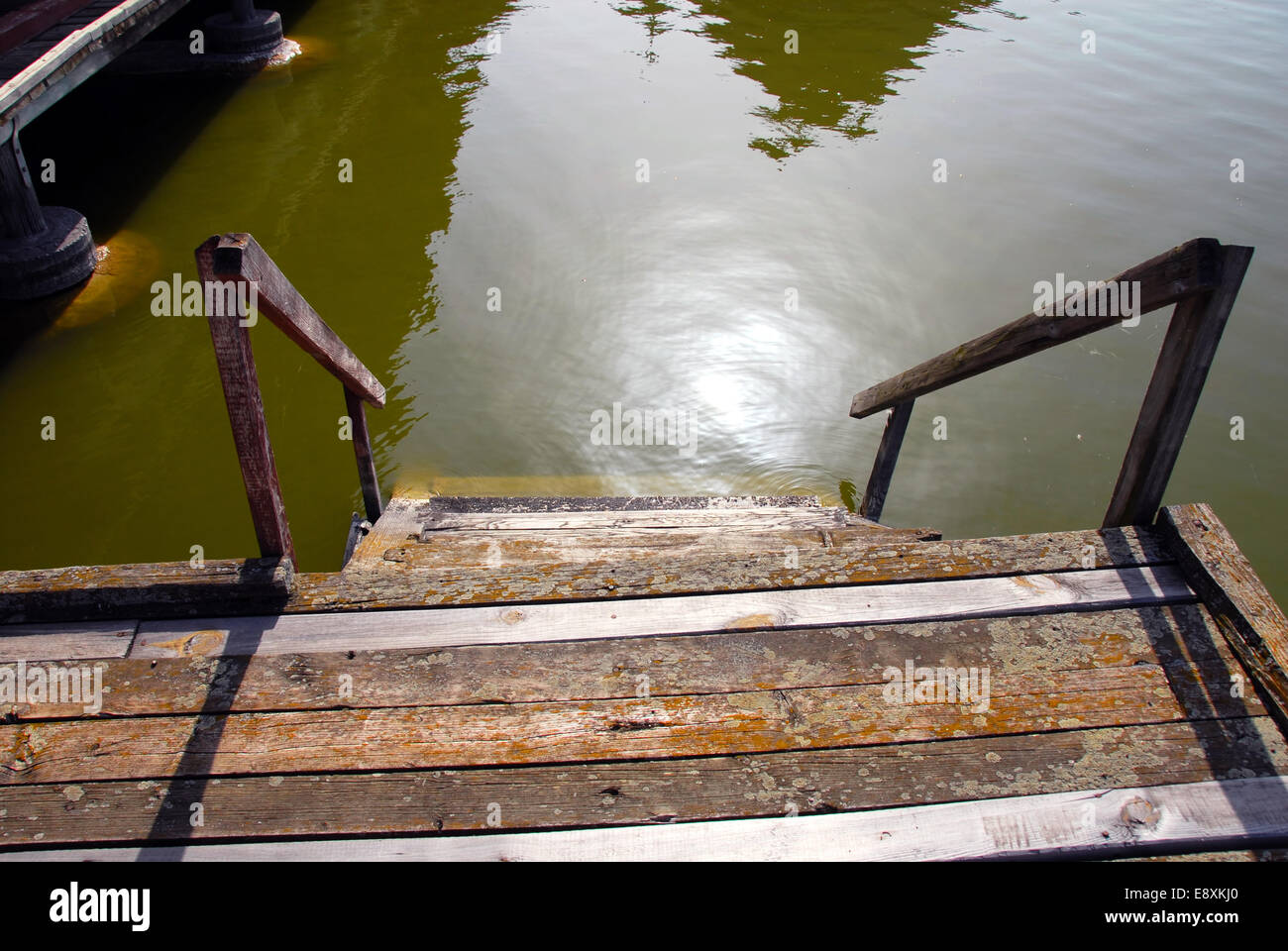 Wooden stairs into water Stock Photo - Alamy
