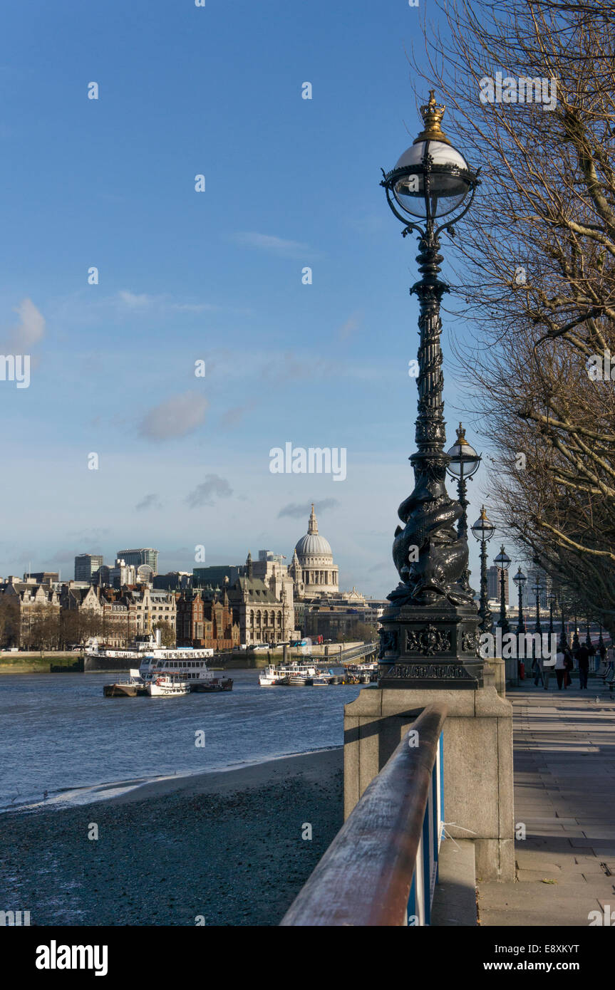 Under blue sky, The Queen's Walk with iconic cast-iron dolphin lamps ...