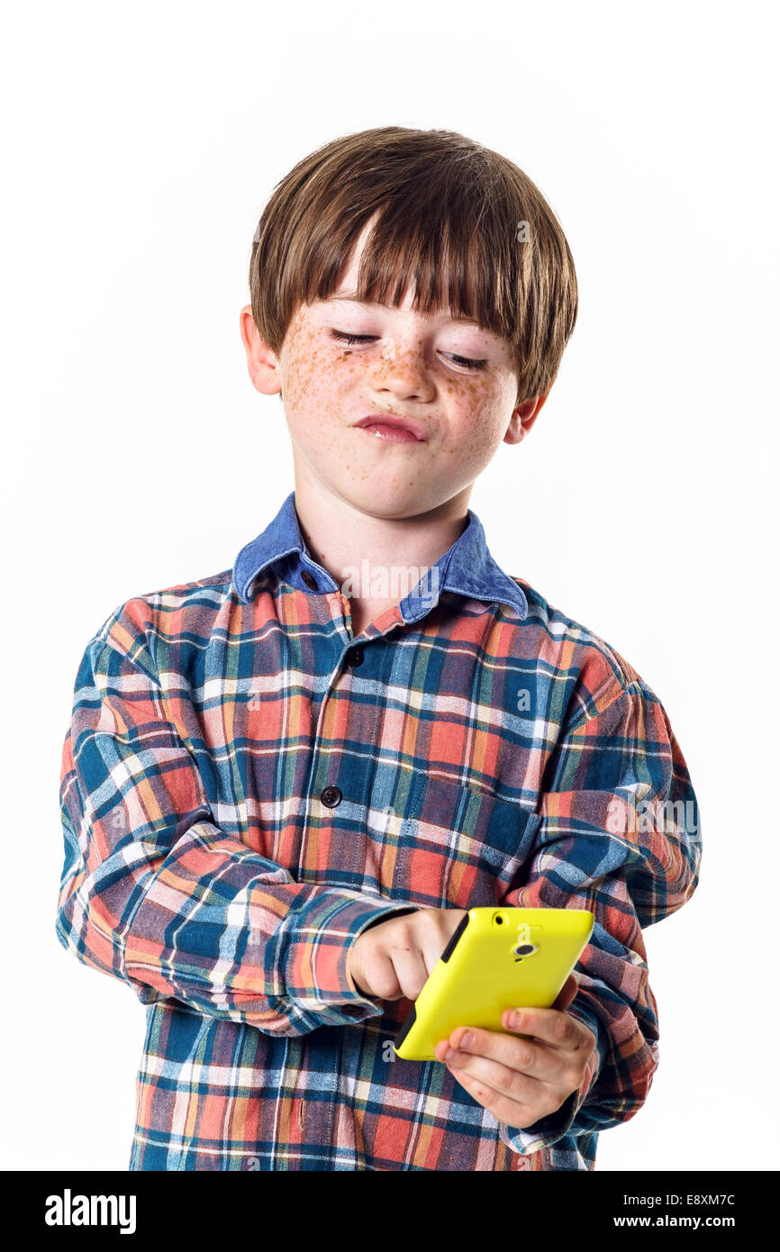 Red-haired funny boy with yellow mobile phone, preschooler Stock Photo ...
