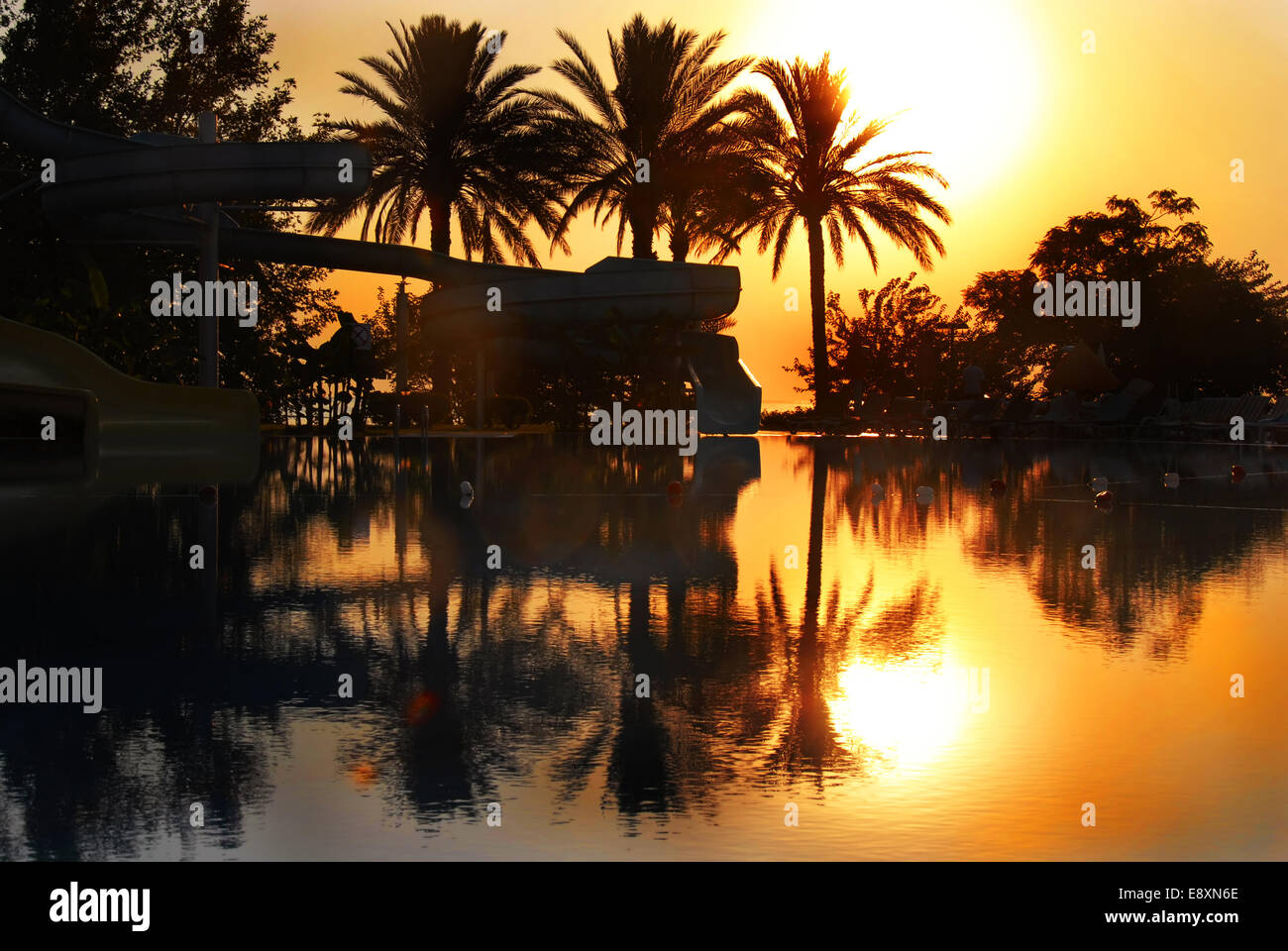 Sunrise over swimming pool Stock Photo - Alamy