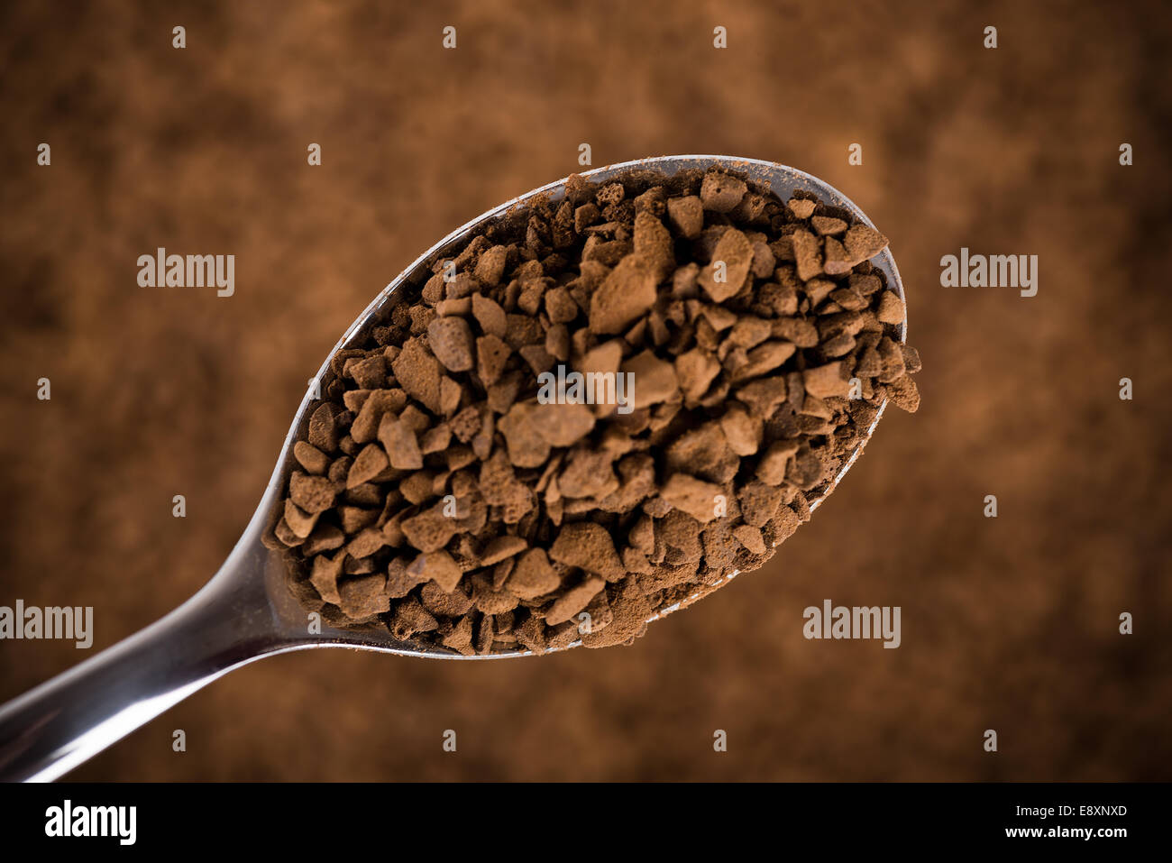 Spoon of coffee at coffee background Stock Photo - Alamy