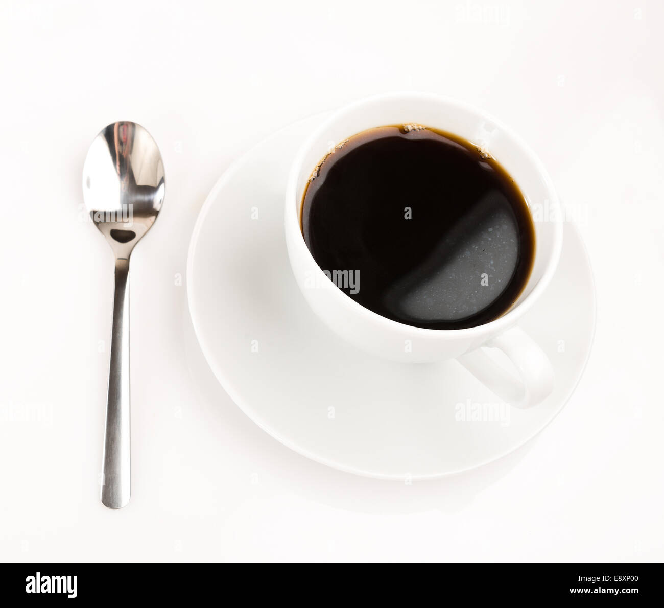 coffee cup and spoon on white background Stock Photo - Alamy