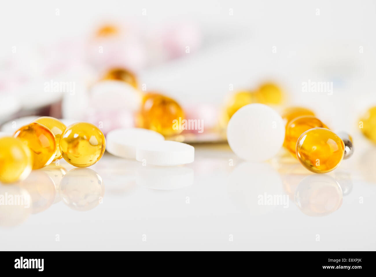 Colorful tablets with capsules Stock Photo - Alamy