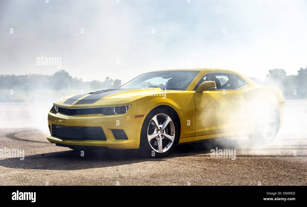 Luxury yellow sport car drifting, motion capture Stock Photo - Alamy