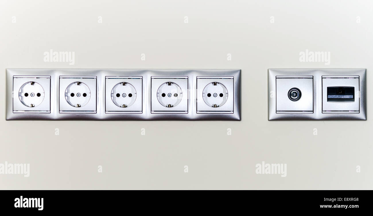 Electric sockets in line, house interior details Stock Photo - Alamy