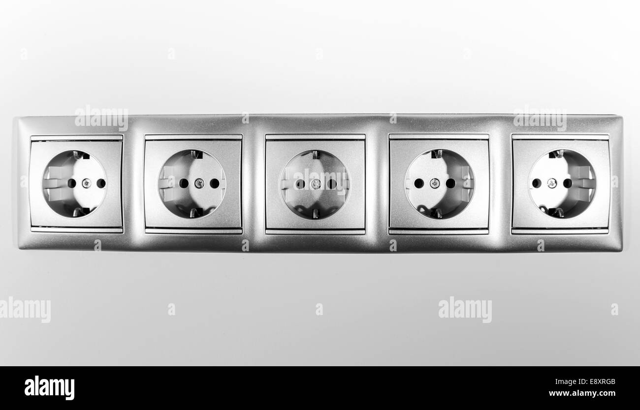 Electric sockets in line, house interior details Stock Photo - Alamy