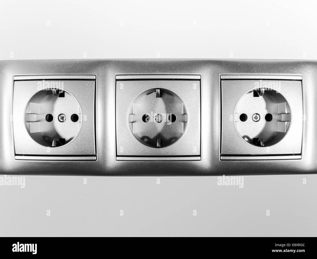 Electric sockets in line, house interior details Stock Photo - Alamy