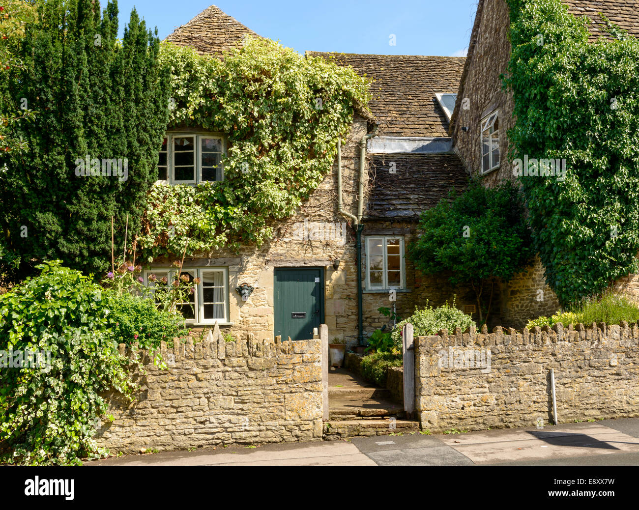 medieval stone cottage with a lot of vegetation on it, prospecting on a ...