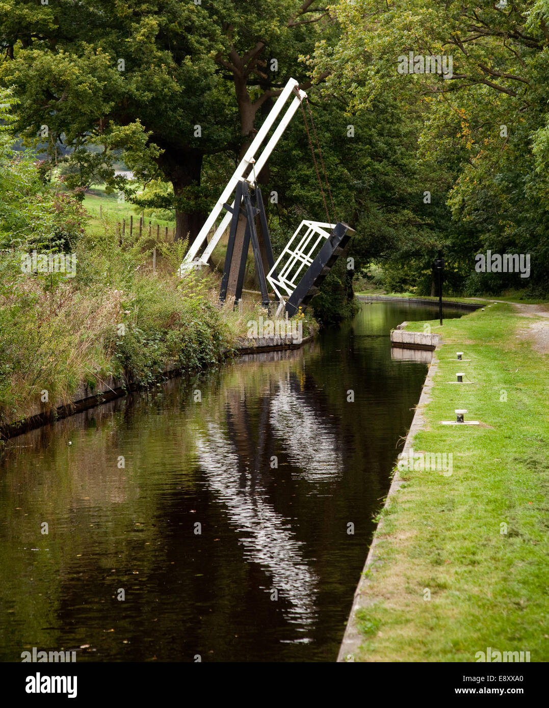 Narrow river with bridge Stock Photo - Alamy