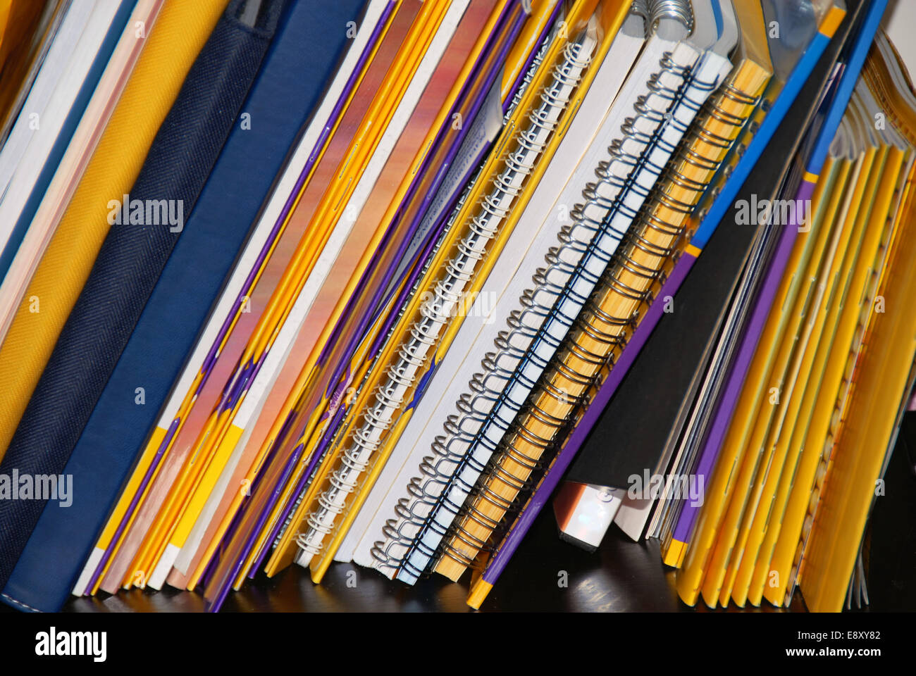 Notebooks on shelf Stock Photo - Alamy