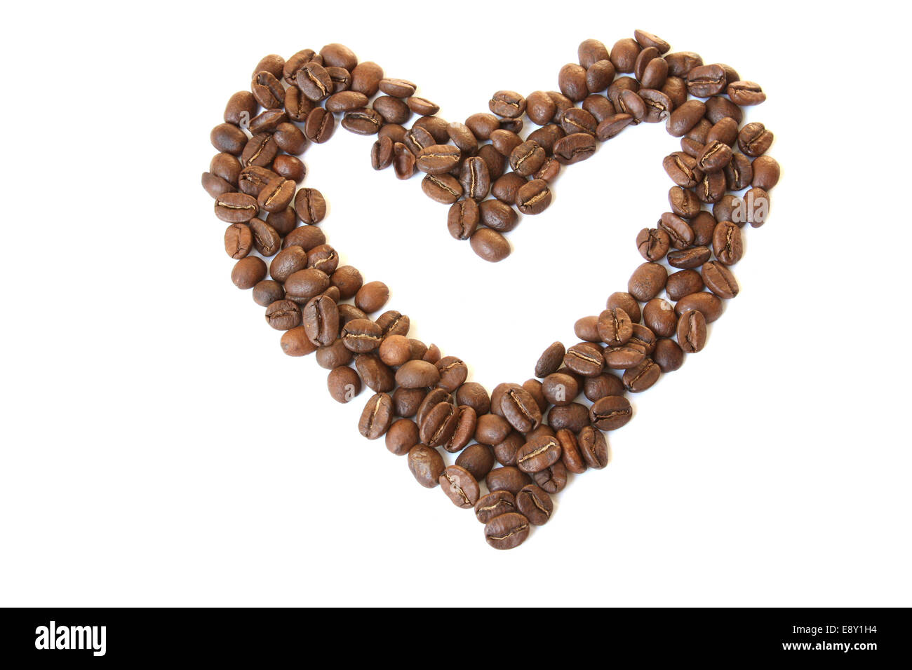 Heart shaped coffee beans. Isolated on white Stock Photo - Alamy