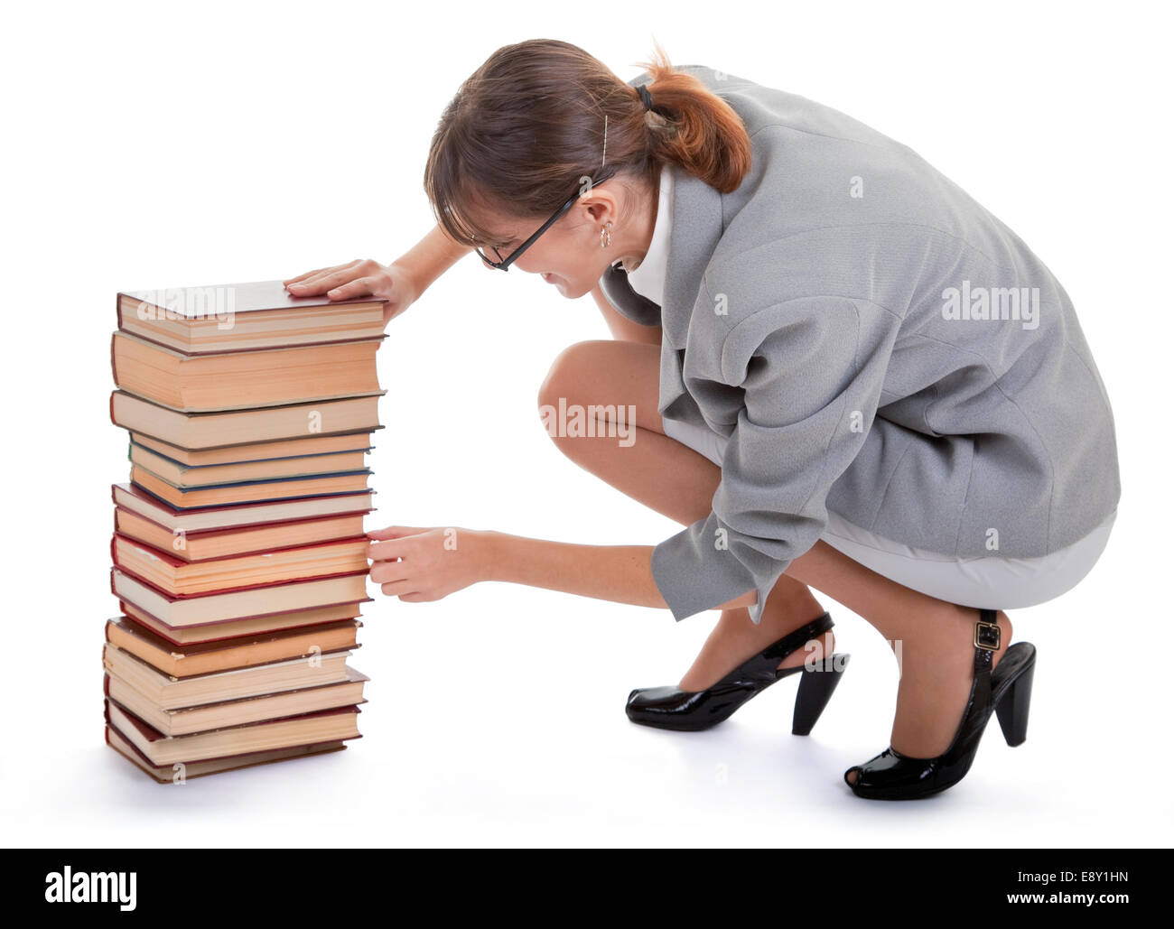 woman and a pile of books Stock Photo - Alamy
