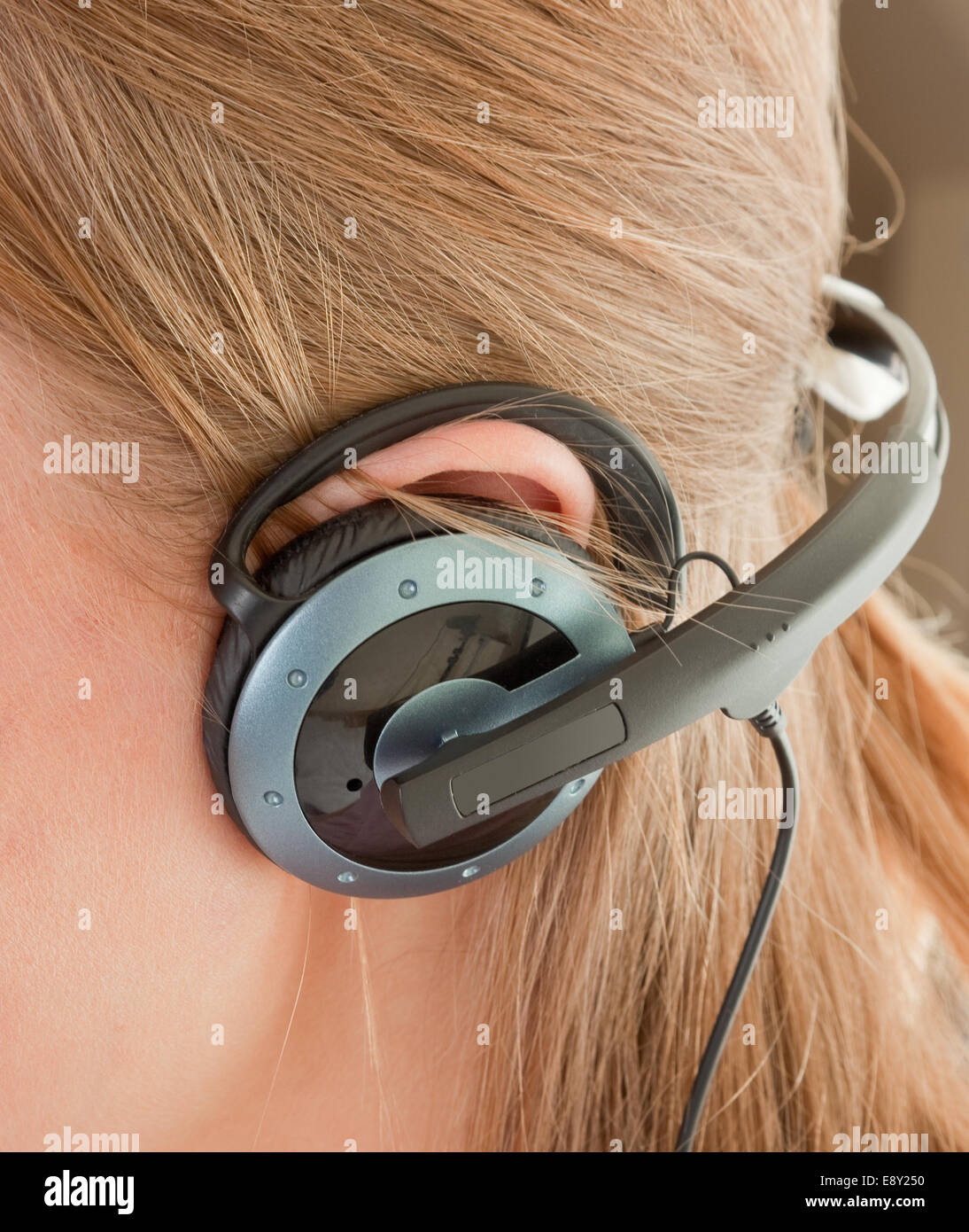 ear with headphones Stock Photo - Alamy