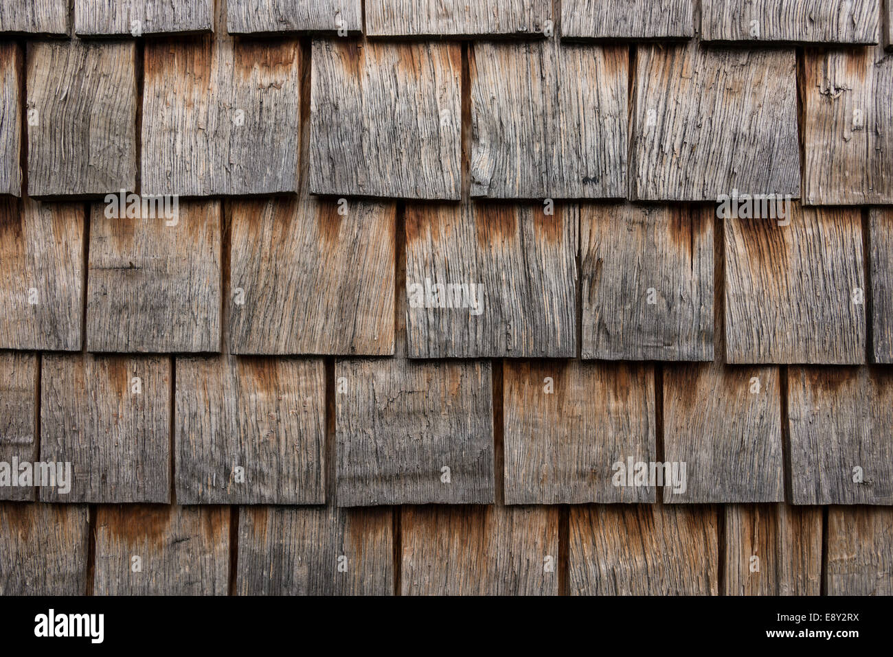 Wooden shingles used to clad the exterior of a building, weathering to ...