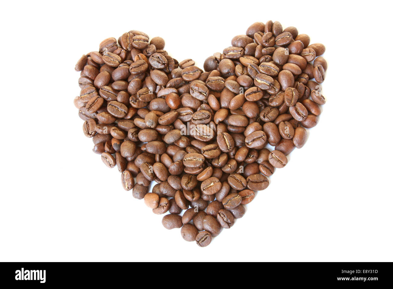 Heart shaped coffee beans. Isolated on white Stock Photo - Alamy