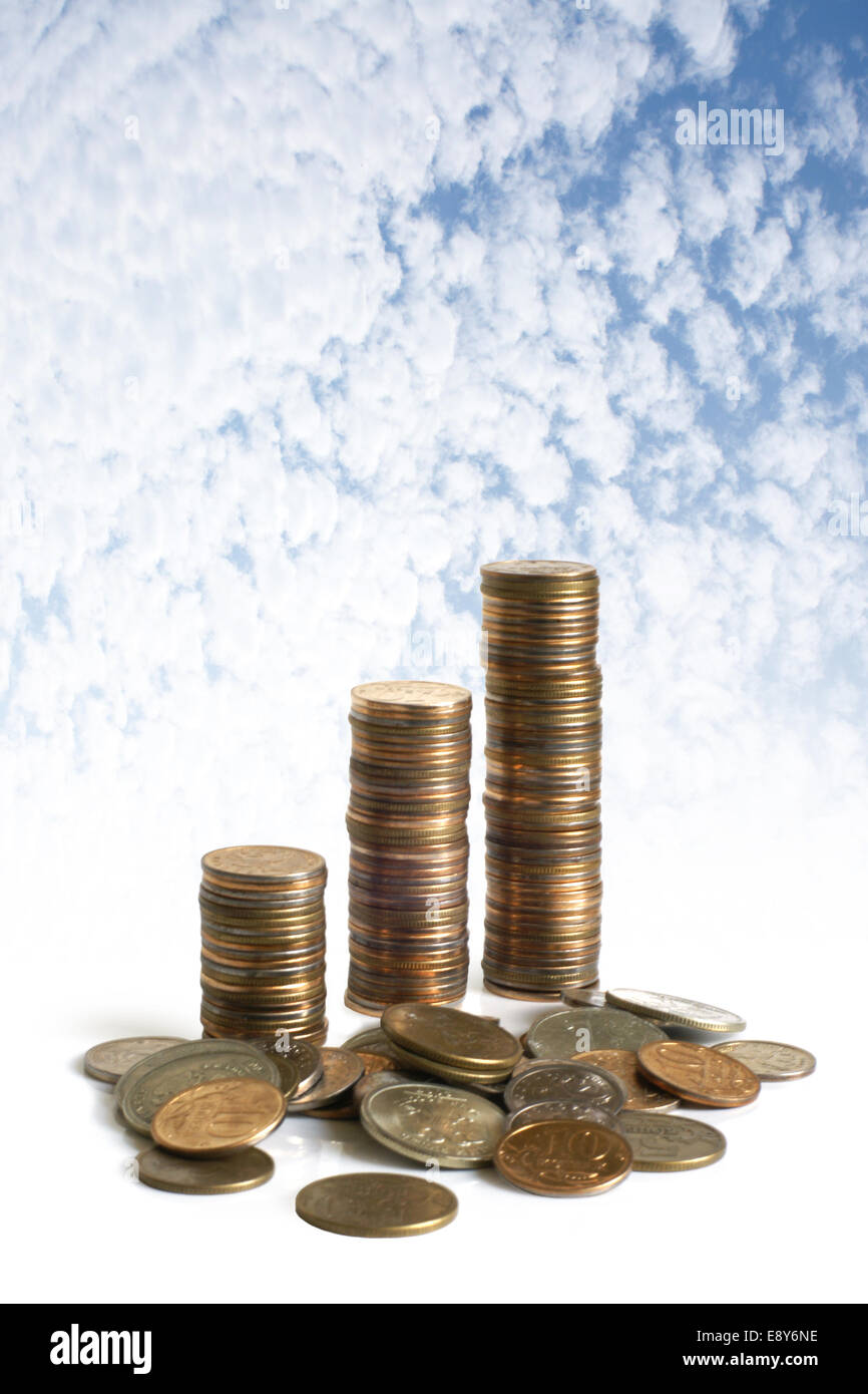 Coins on blue sky Stock Photo - Alamy